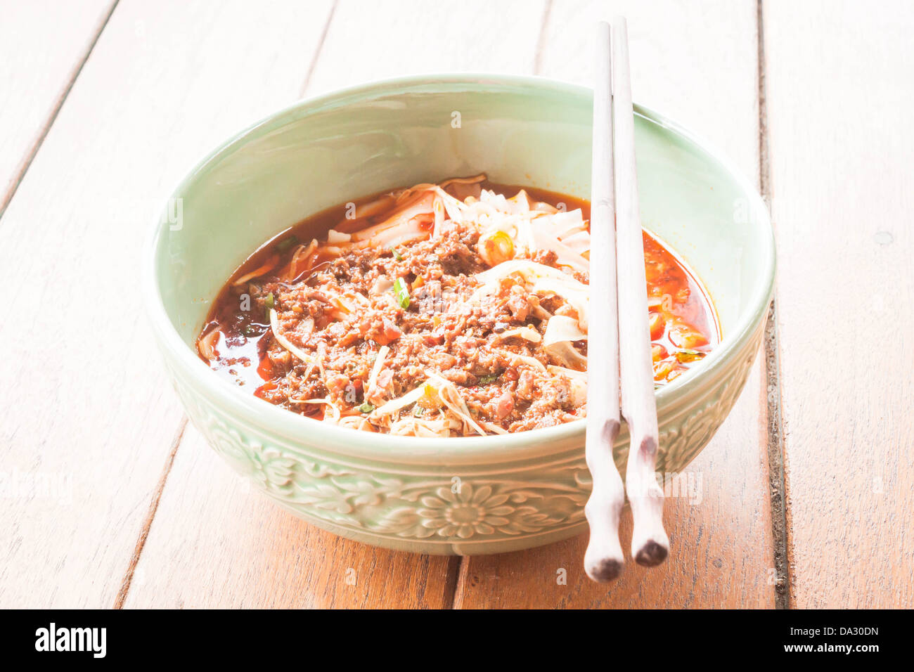 Bowl of spicy noodle soup with chopsticks Stock Photo - Alamy