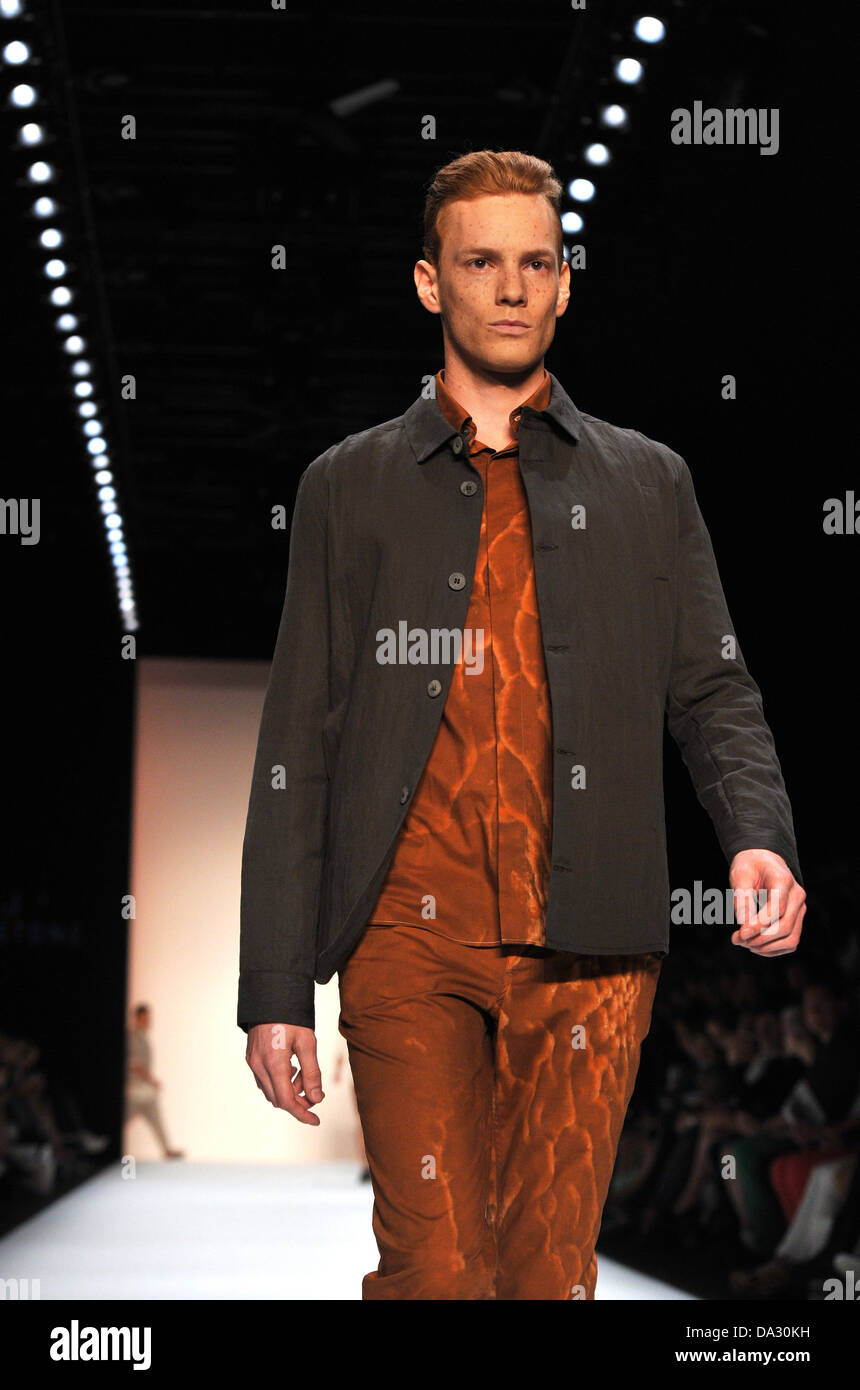 Berlin, Germany. 2nd July 2013. A male model presents a creation at the ...