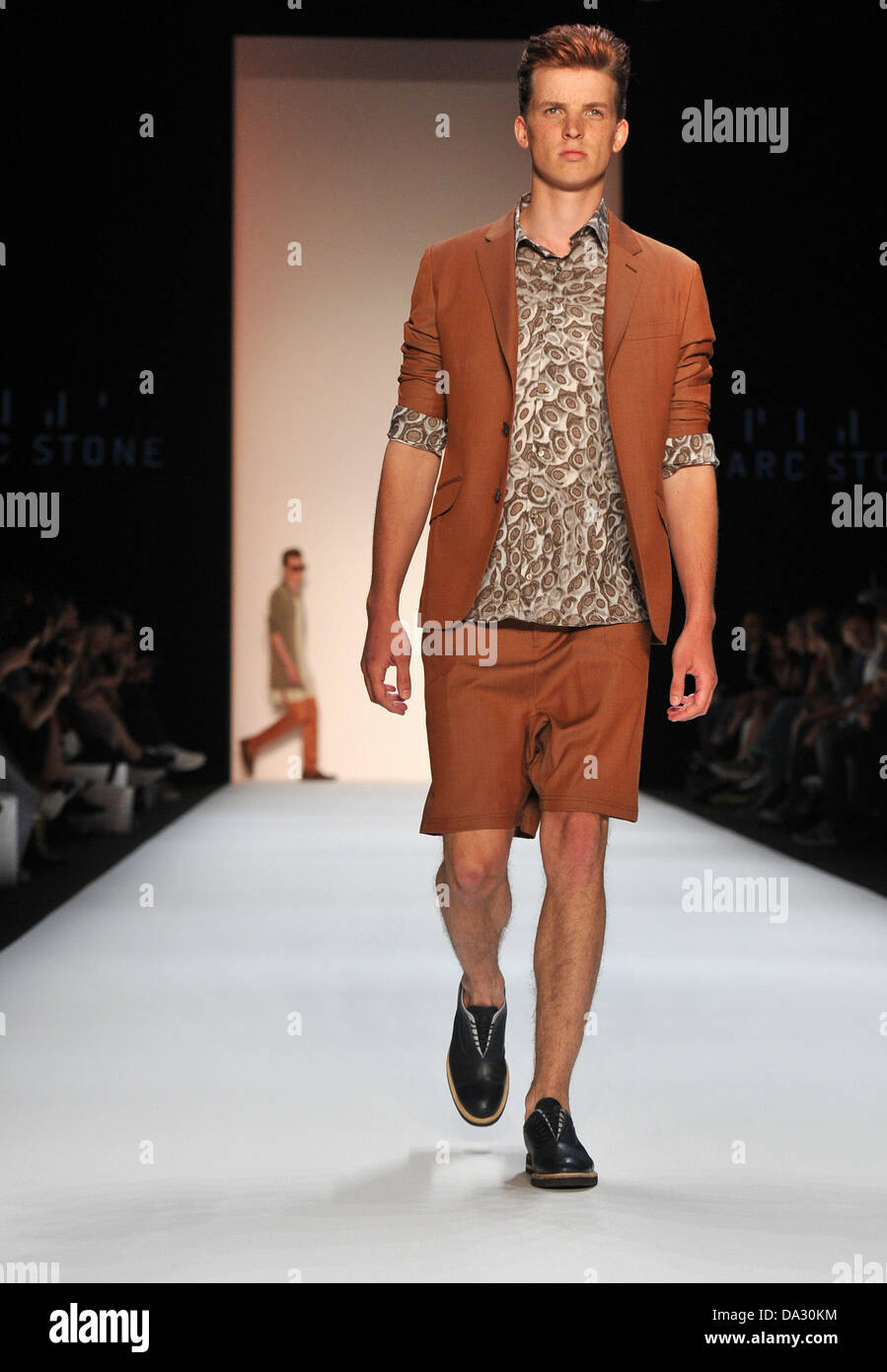 Berlin, Germany. 2nd July 2013. A male model presents a creation at the ...