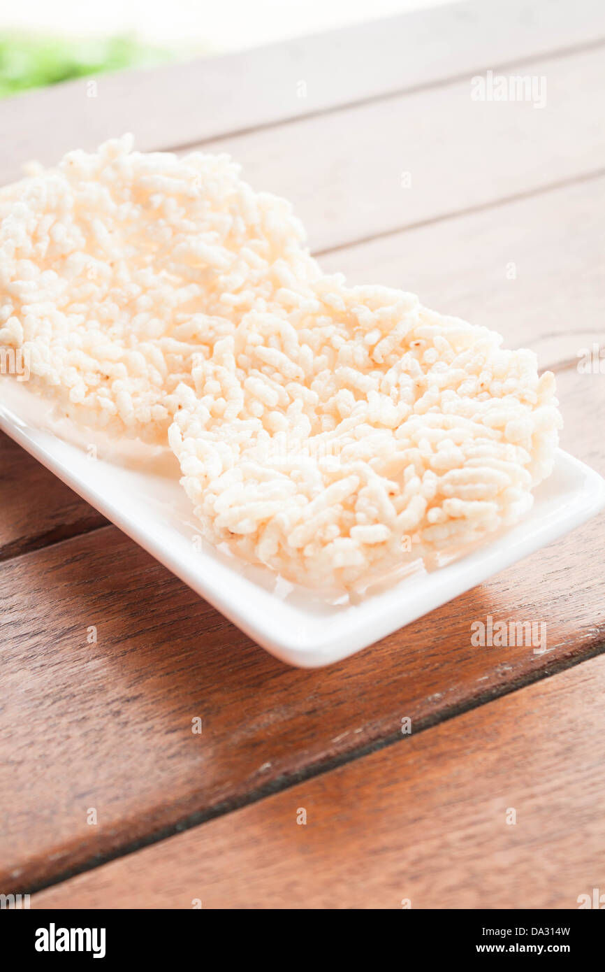 White dish of thai style crispy rice cracker Stock Photo - Alamy