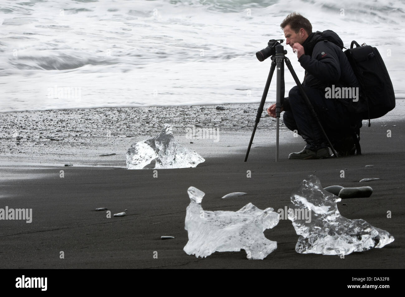Mark Hamblin photographing at Jokulsarlon (glacier lagoon) Southern ...