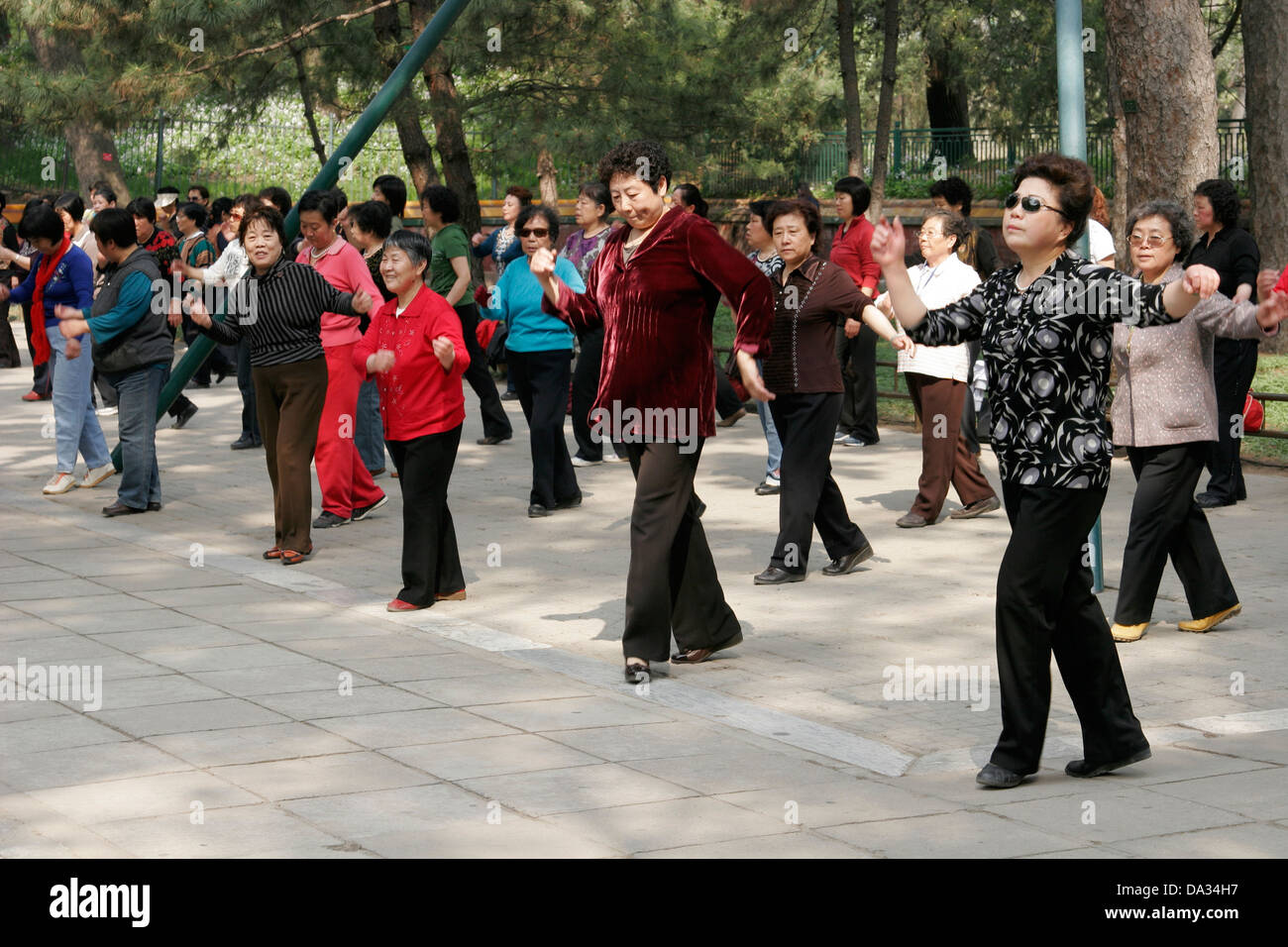 Chinese people exercising in the park of Summer Palace, Beijing, China ...
