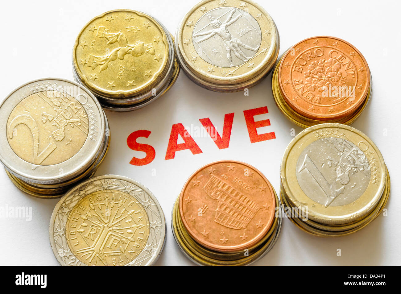 Many Euro coins and red "Save Stock Photo - Alamy