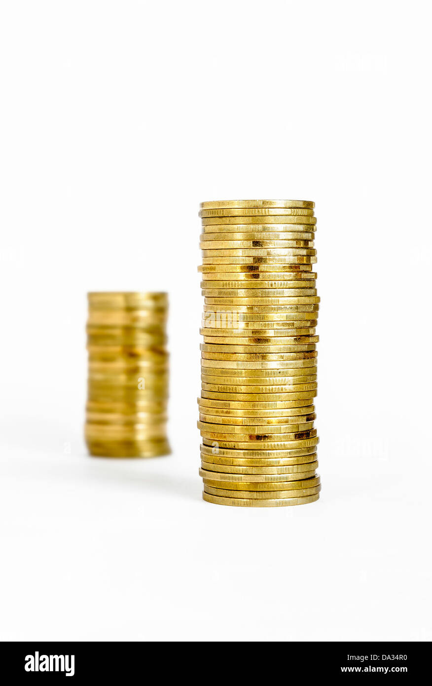 Two piles of coins Cut Out Stock Images & Pictures - Alamy