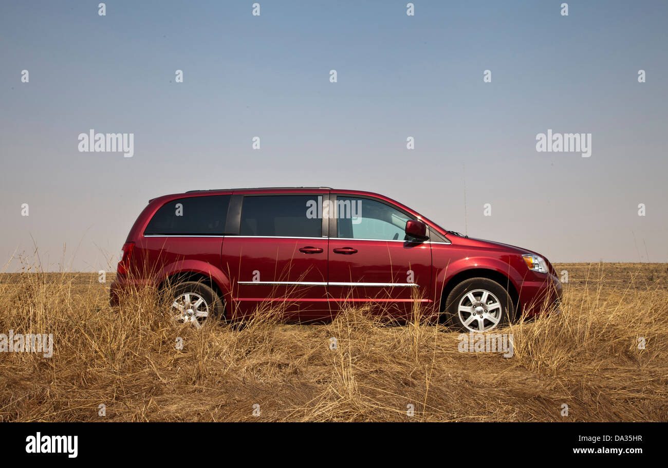 Red estate wagon parked under a blue sky in wheat field The Palouse ...