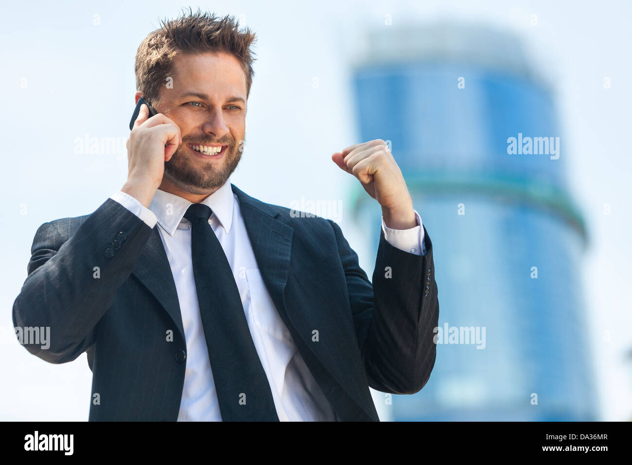 A young successful man male executive businessman talking on his mobile ...