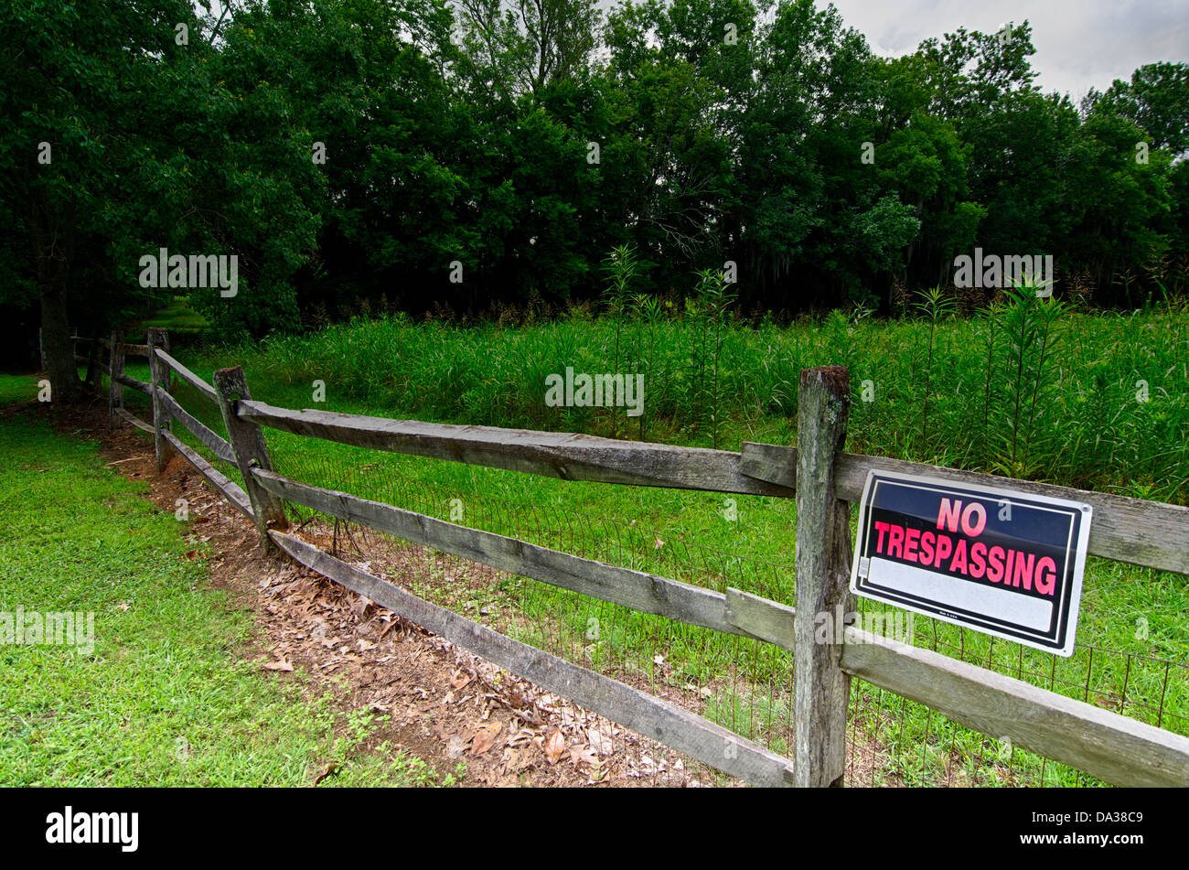 No trespassing sign on wooden fence in rural area Stock Photo - Alamy
