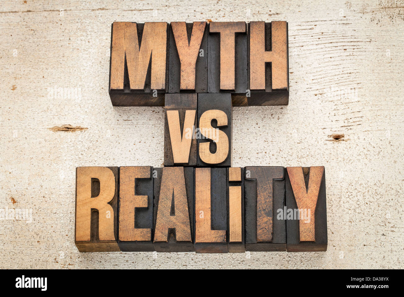 myth versus reality - concept in vintage letterpress wood type on a ...