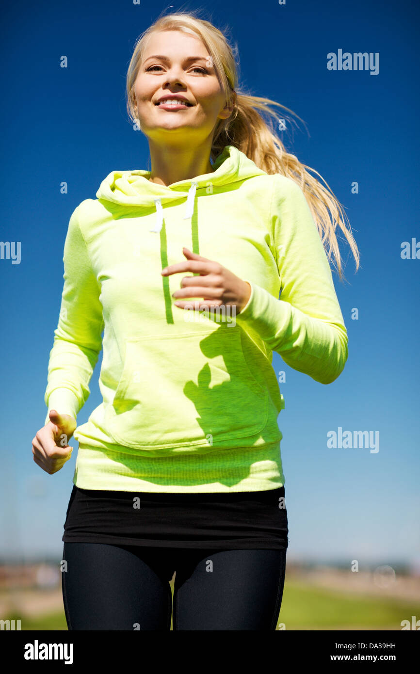 woman jogging outdoors Stock Photo - Alamy