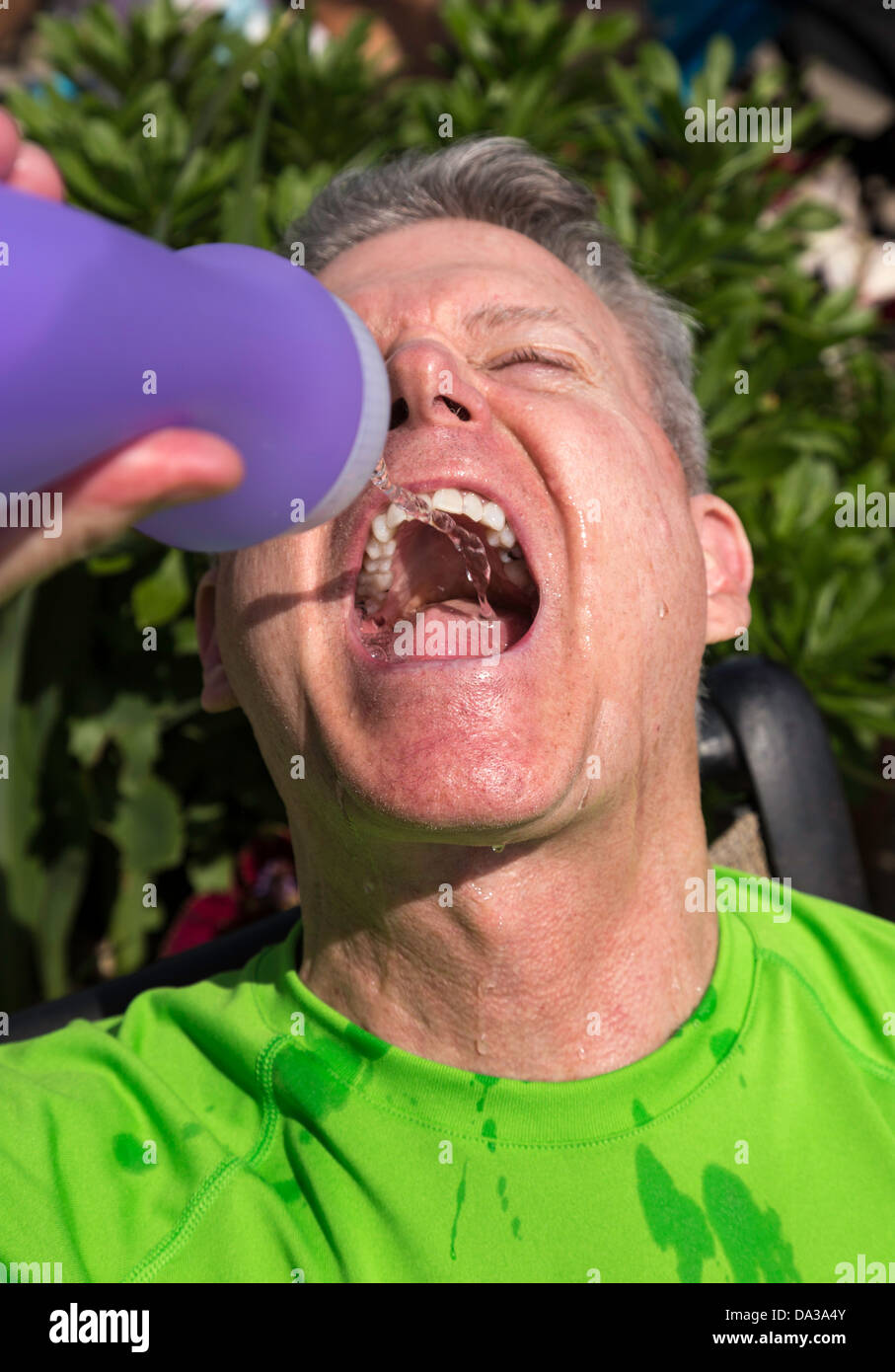 Squirting water bottle hi-res stock photography and images - Alamy
