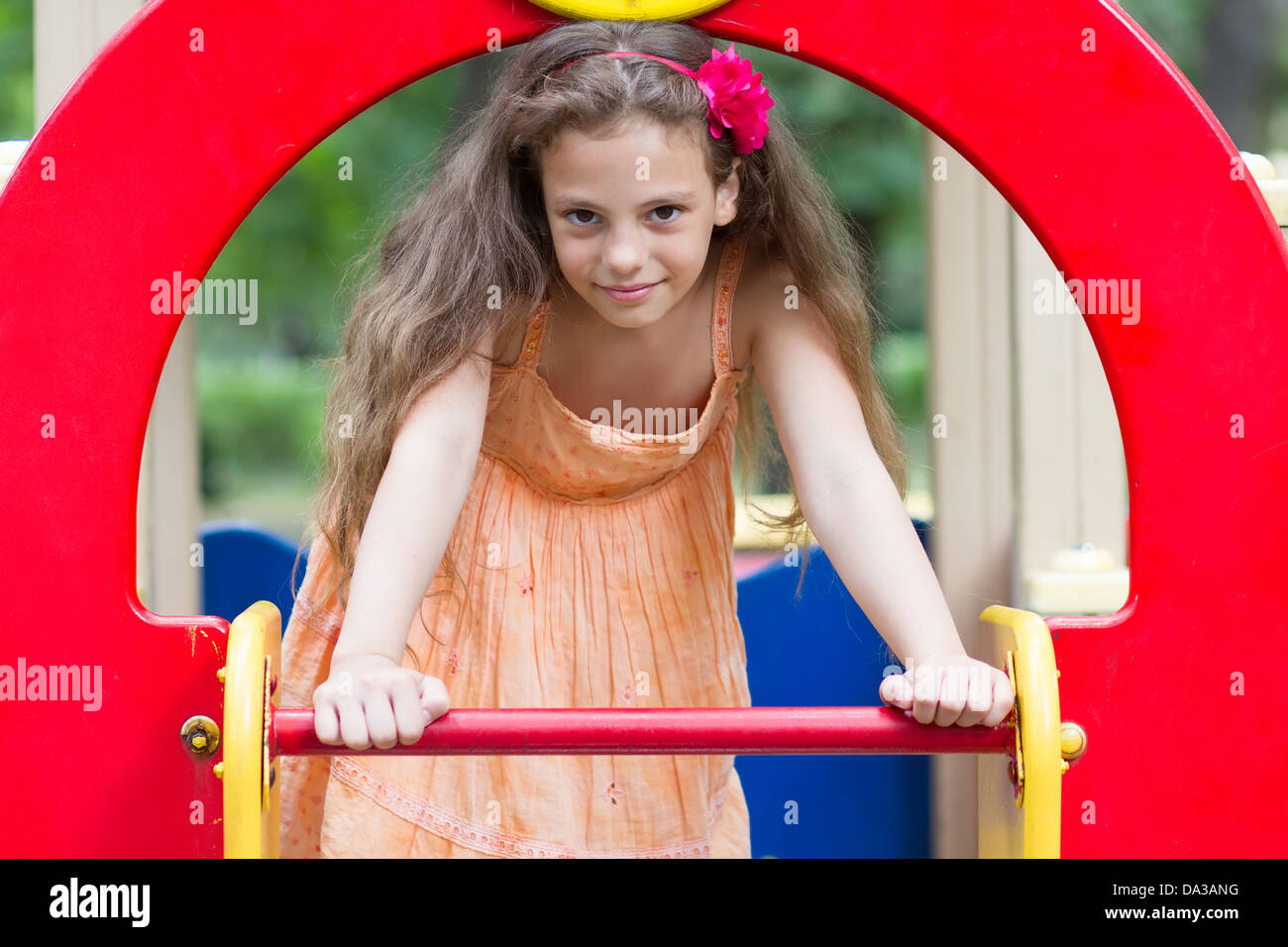 Cute little schoolgirl on the playground at summer day Stock Photo - Alamy