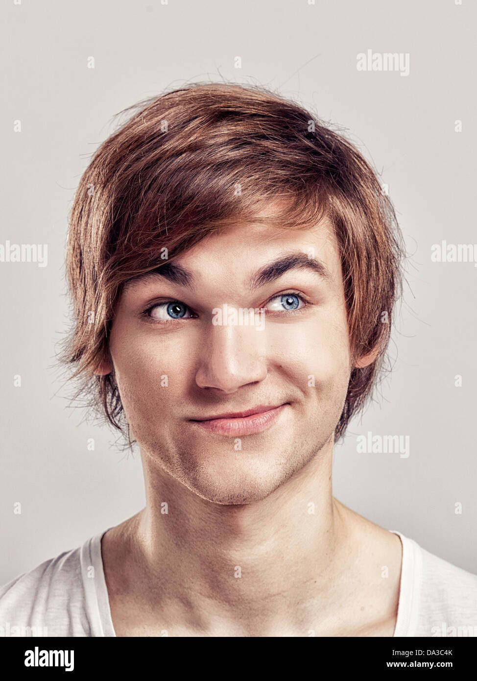 Portrait of a handsome young man, over a gray background Stock Photo ...