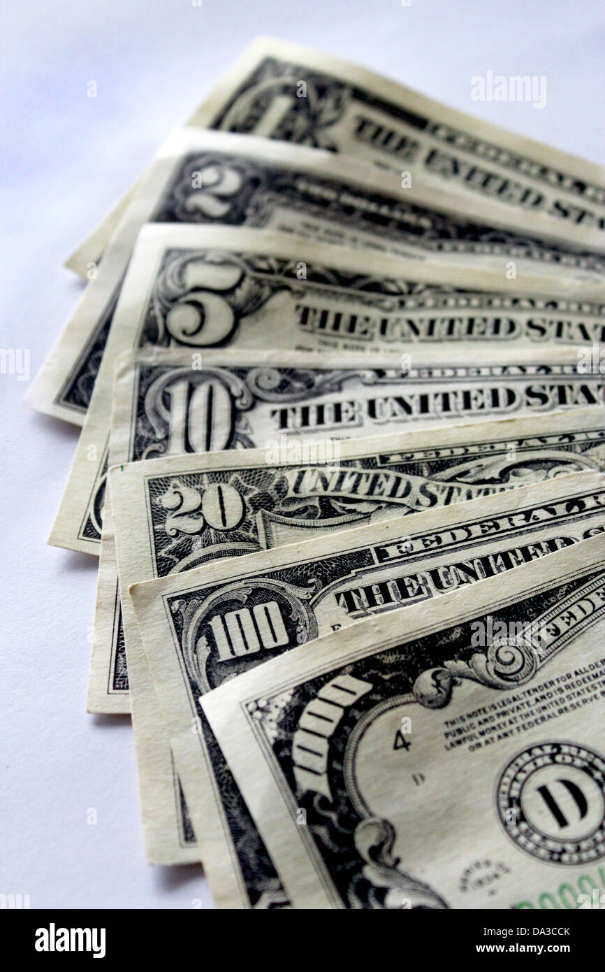 Some dollar banknotes isolated on a white background Stock Photo - Alamy