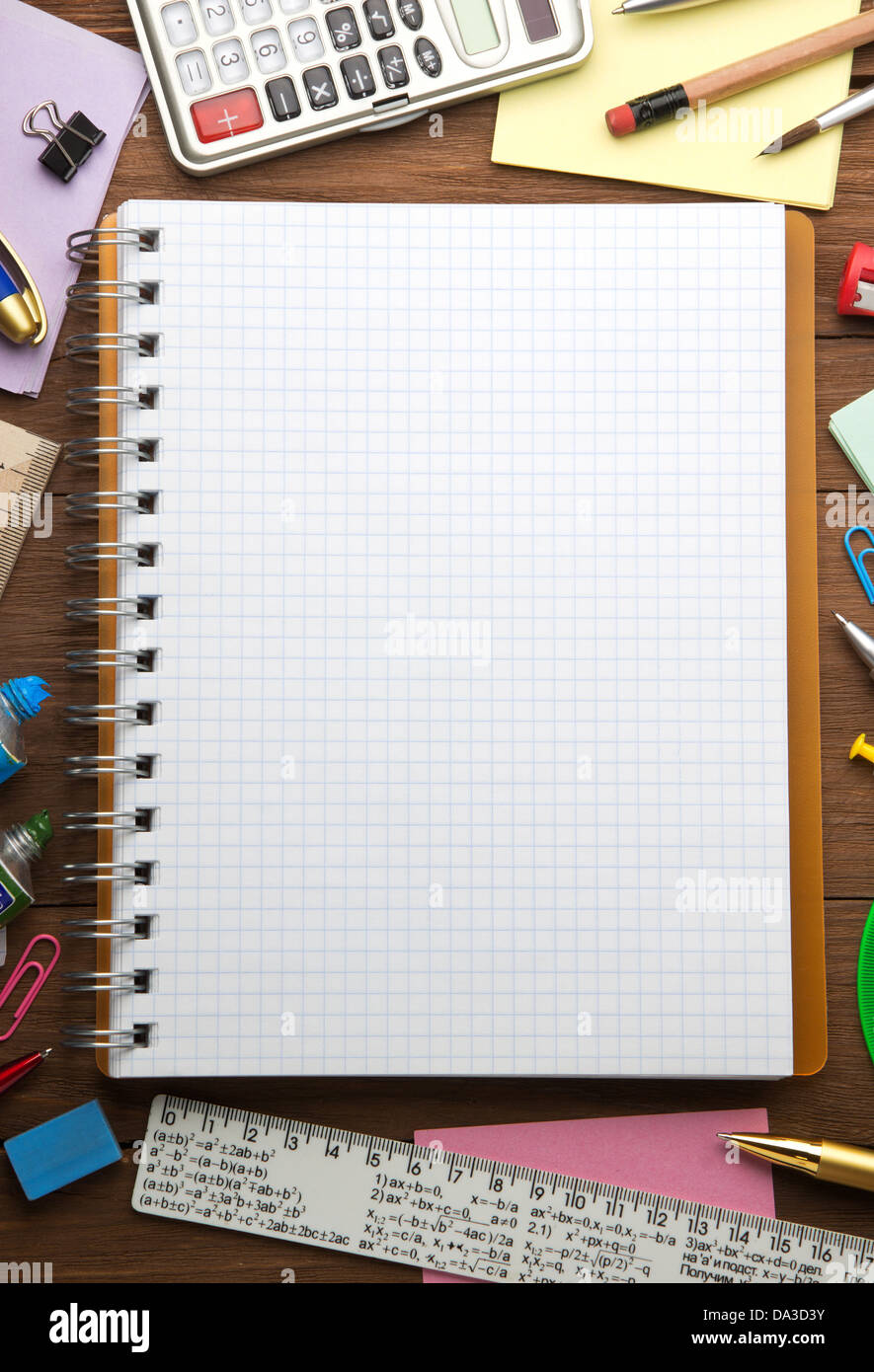 school supplies and checked notebook on wood background Stock Photo - Alamy