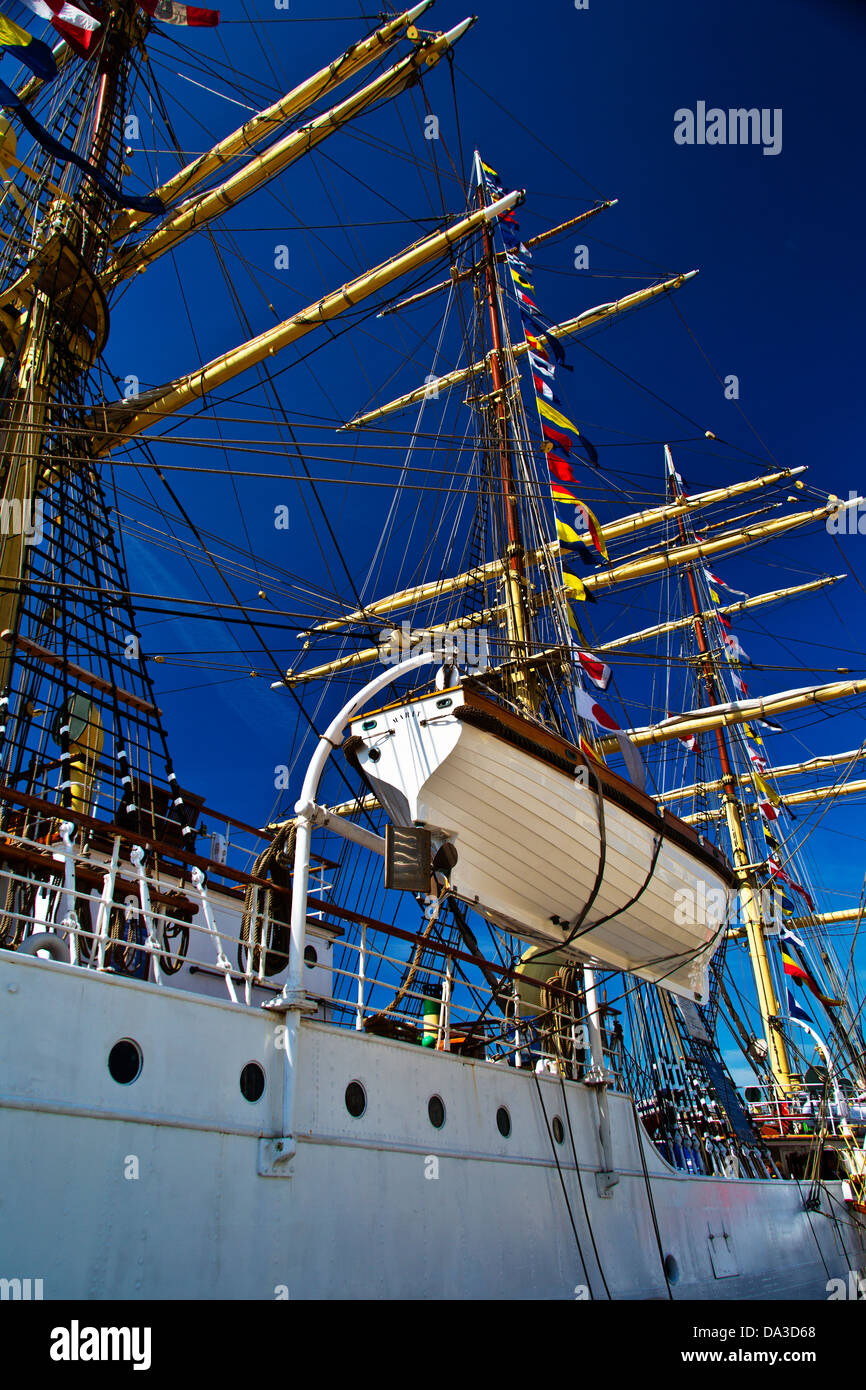 Tall Ship sailing ship with life boat docked in harbor Stock Photo - Alamy