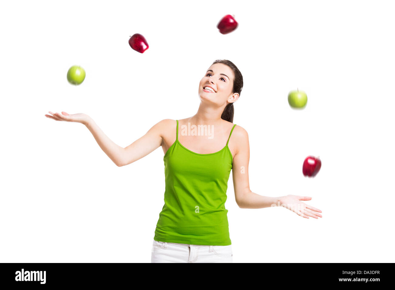 Healthy woman throwing apples, isolated over a white background Stock ...