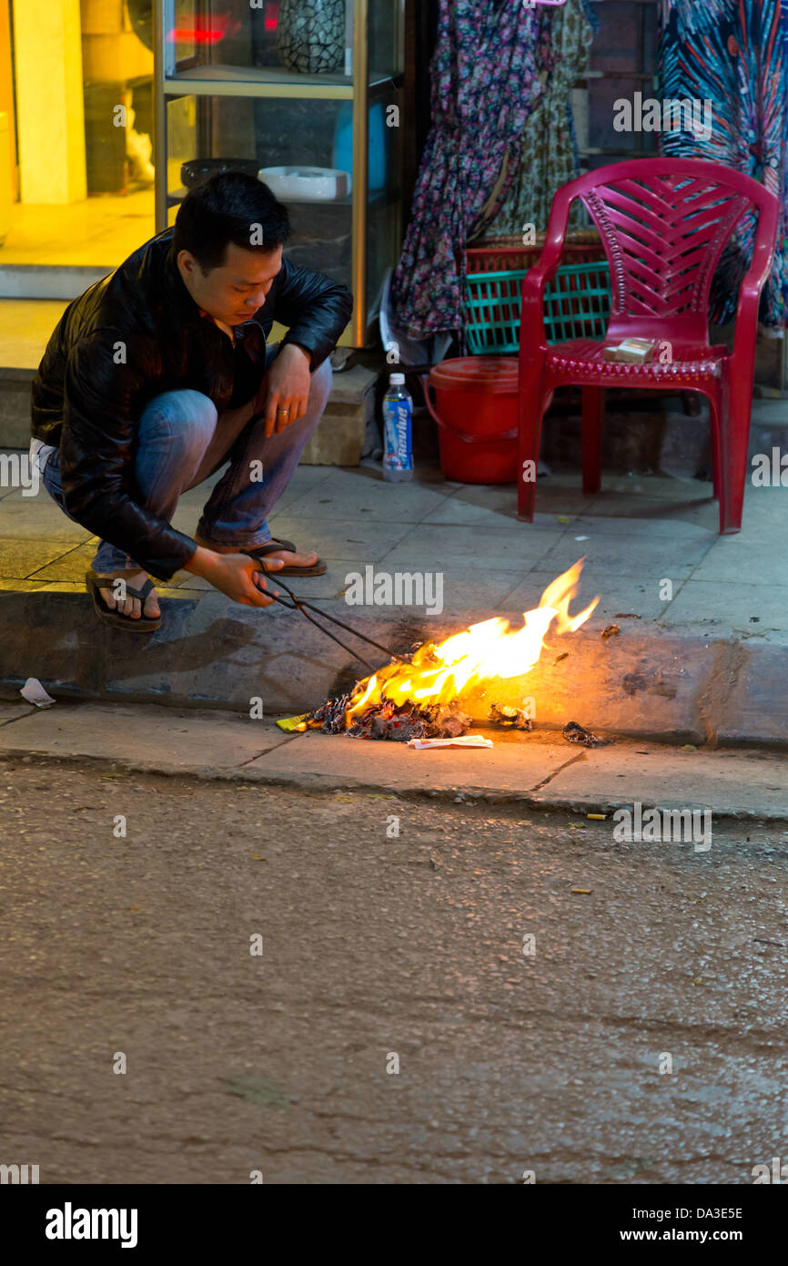 Fire on the Pavement in the Old Quarter in Hanoi, Vietnam Stock Photo ...