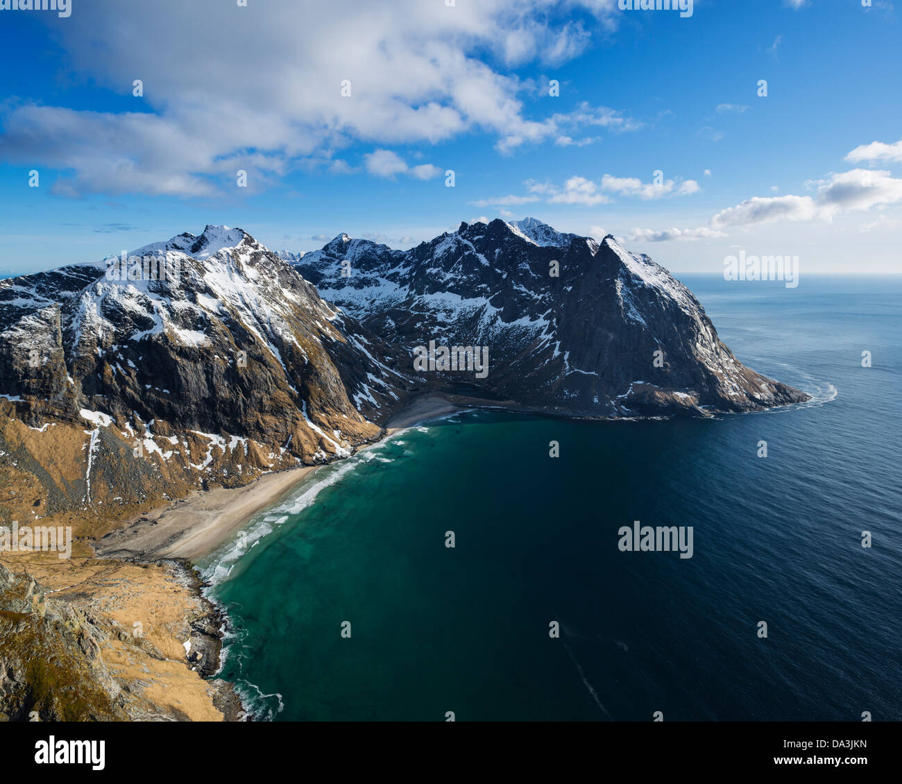 Spring snow and Kvalvika beach seen from Ryten mountain summit ...