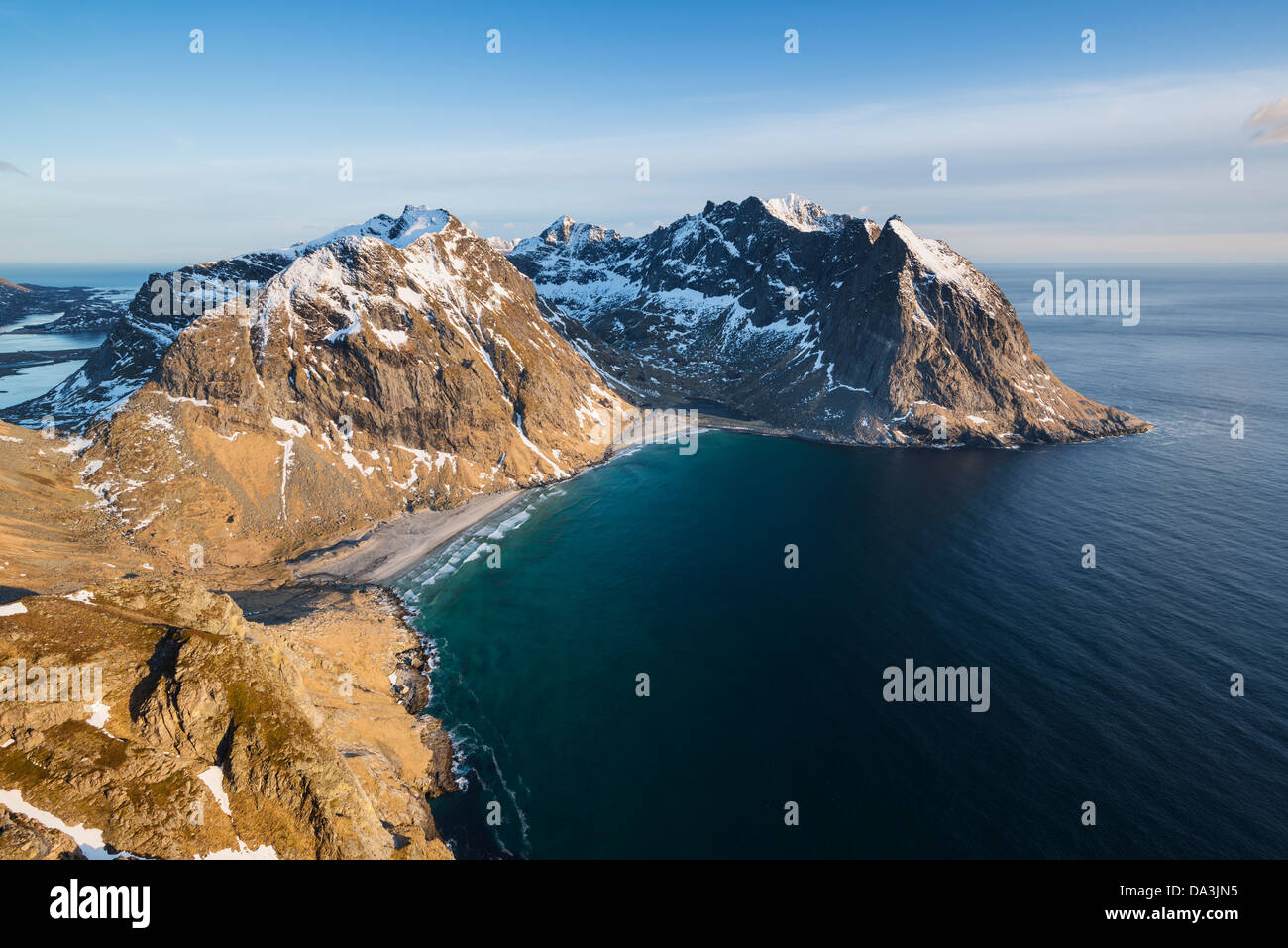 Spring snow and Kvalvika beach seen from Ryten mountain summit ...