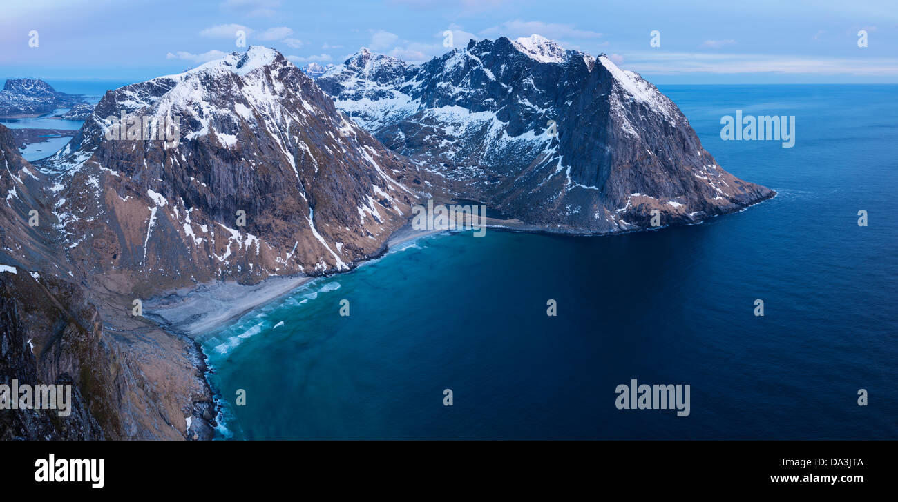 Spring snow and Kvalvika beach seen from Ryten mountain summit ...