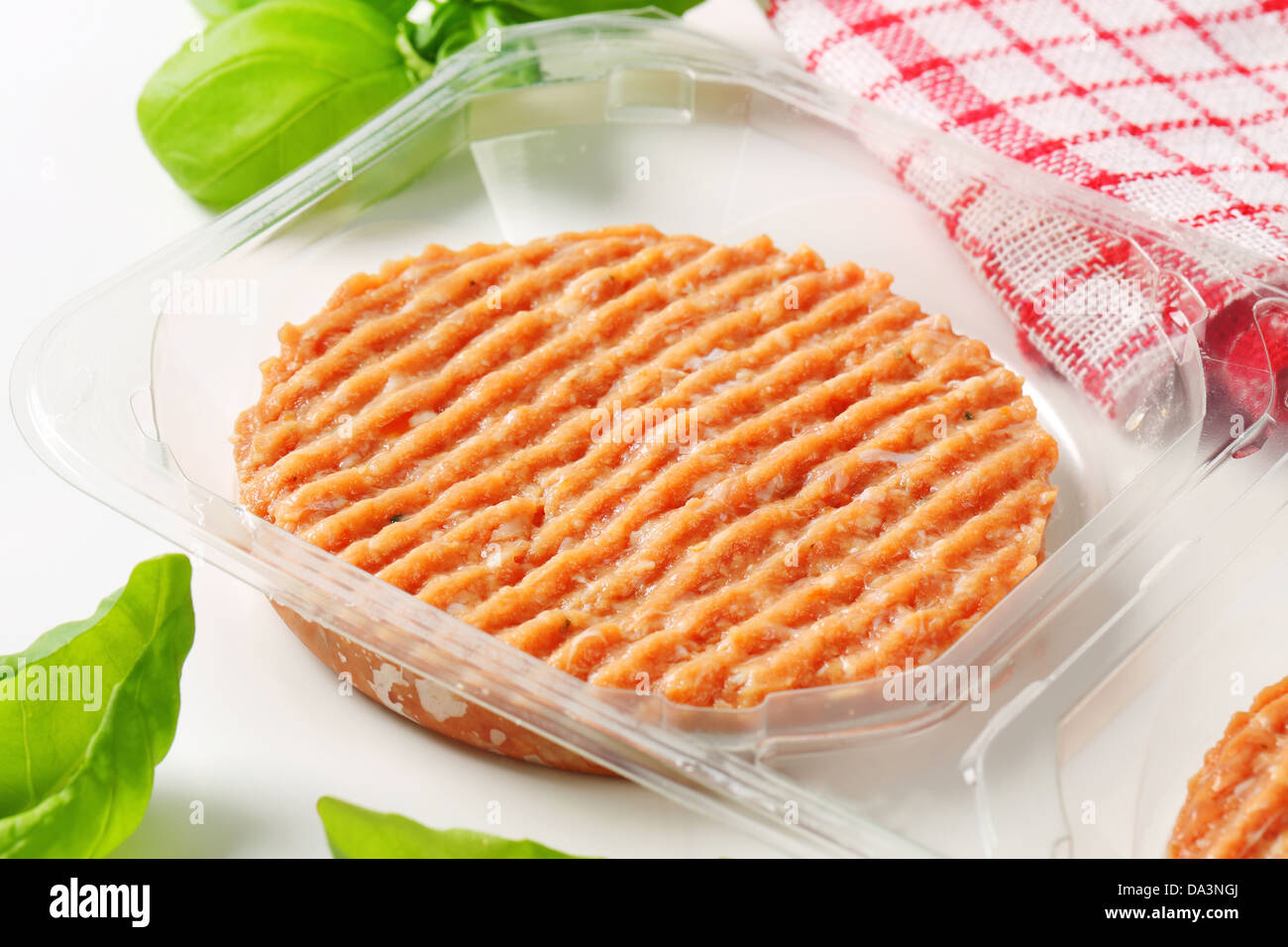 Raw burger patties in plastic packaging Stock Photo - Alamy