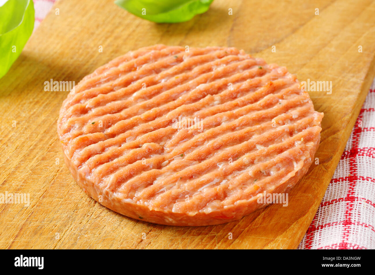 Raw burger patty Stock Photo - Alamy