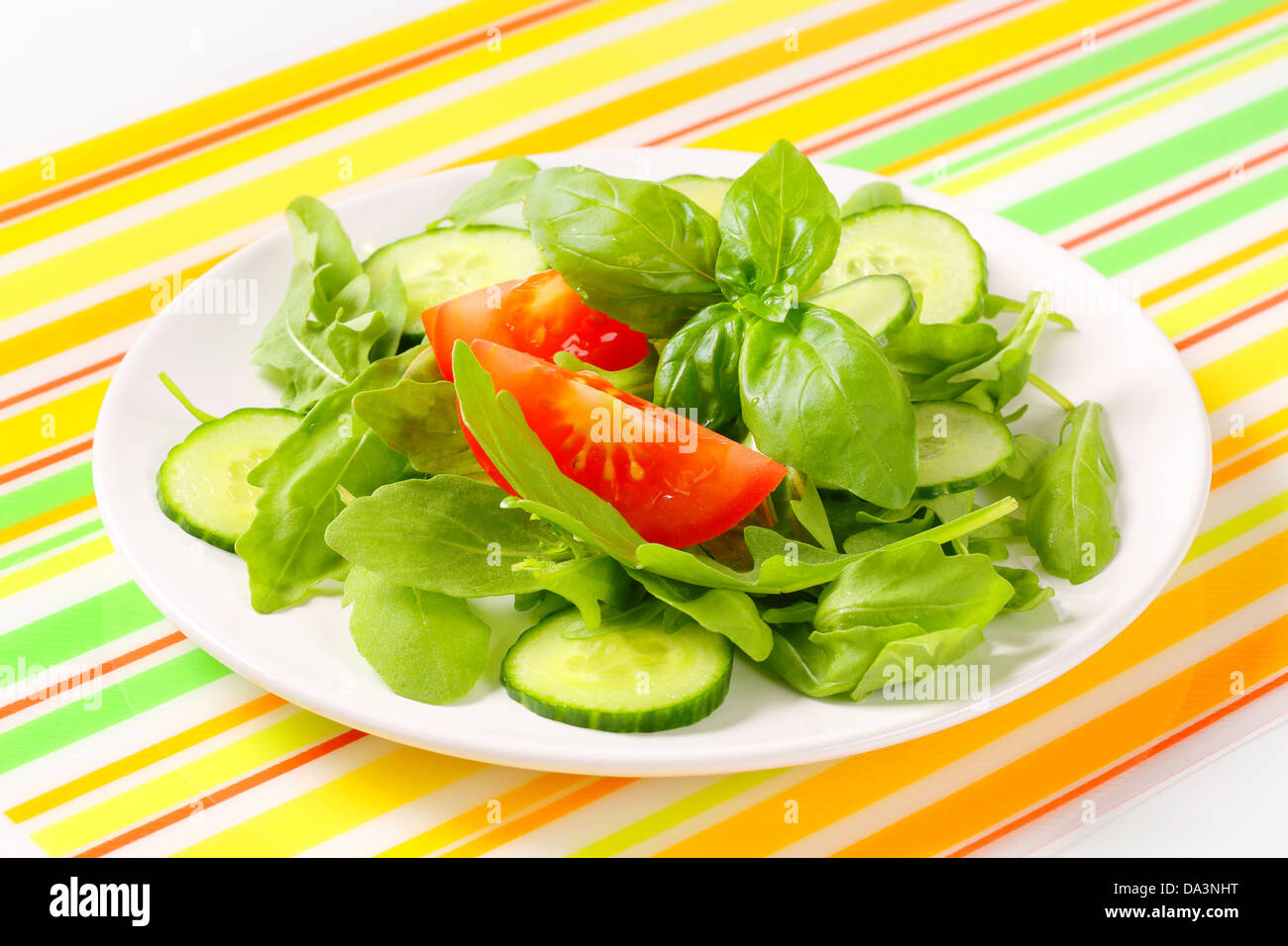 Fresh rocket salad with sliced cucumber Stock Photo - Alamy