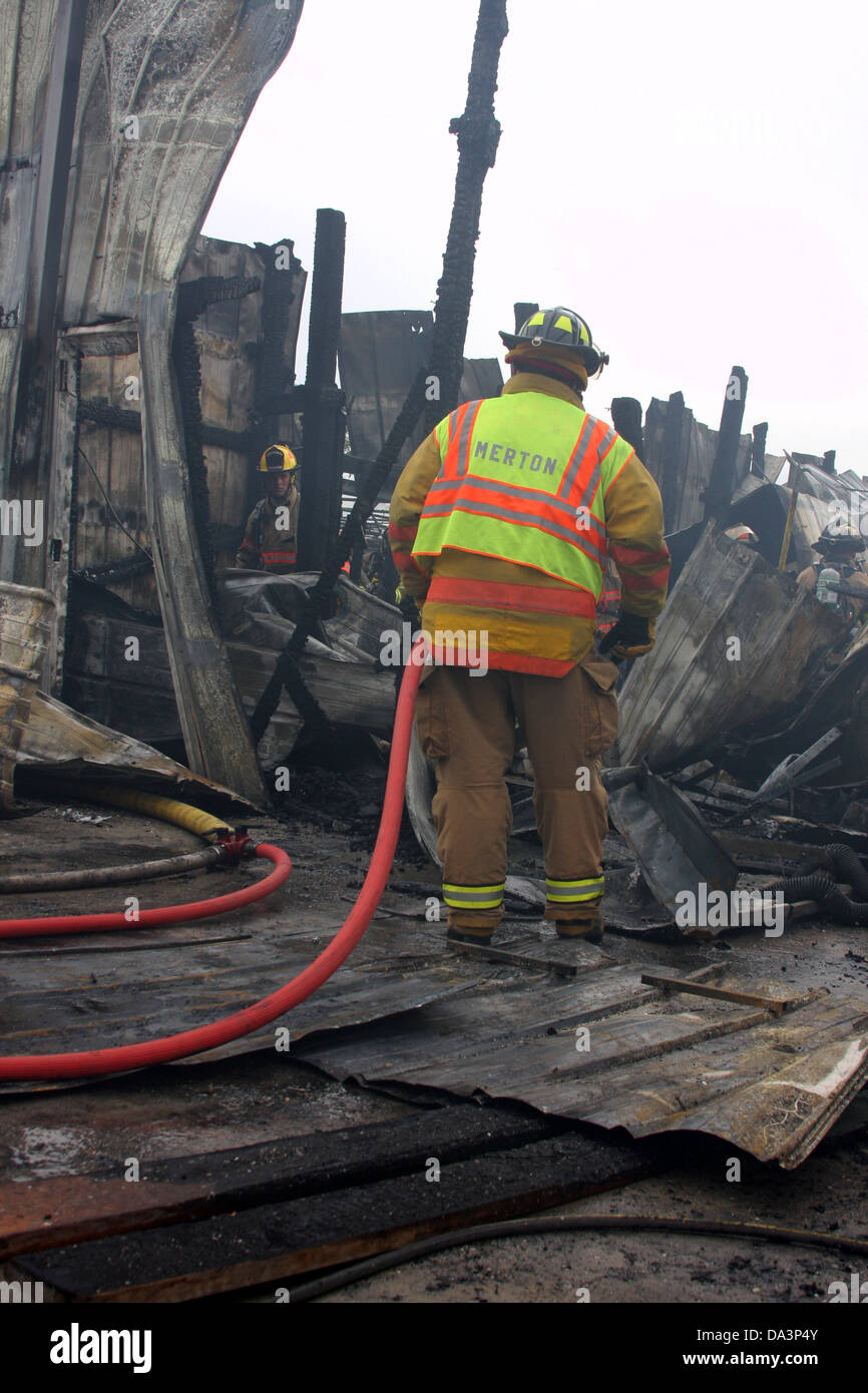 Merton Firefighter holding a hoseline for firefighters searching for ...