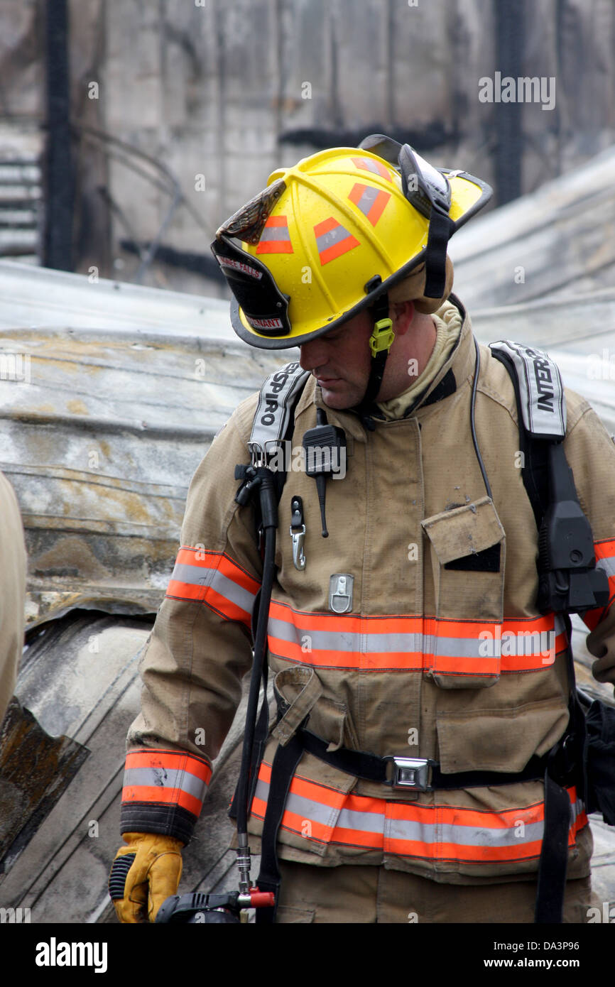 A firefighter at a fire scene Stock Photo - Alamy