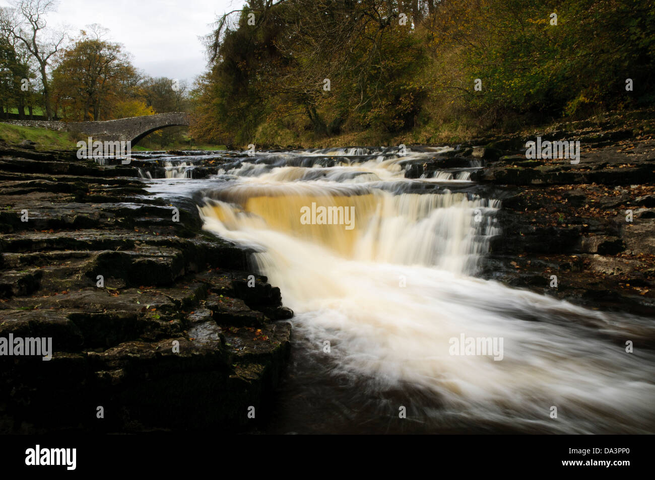 Stainforth Force on the River Ribble in autumn, with the old pack-horse ...