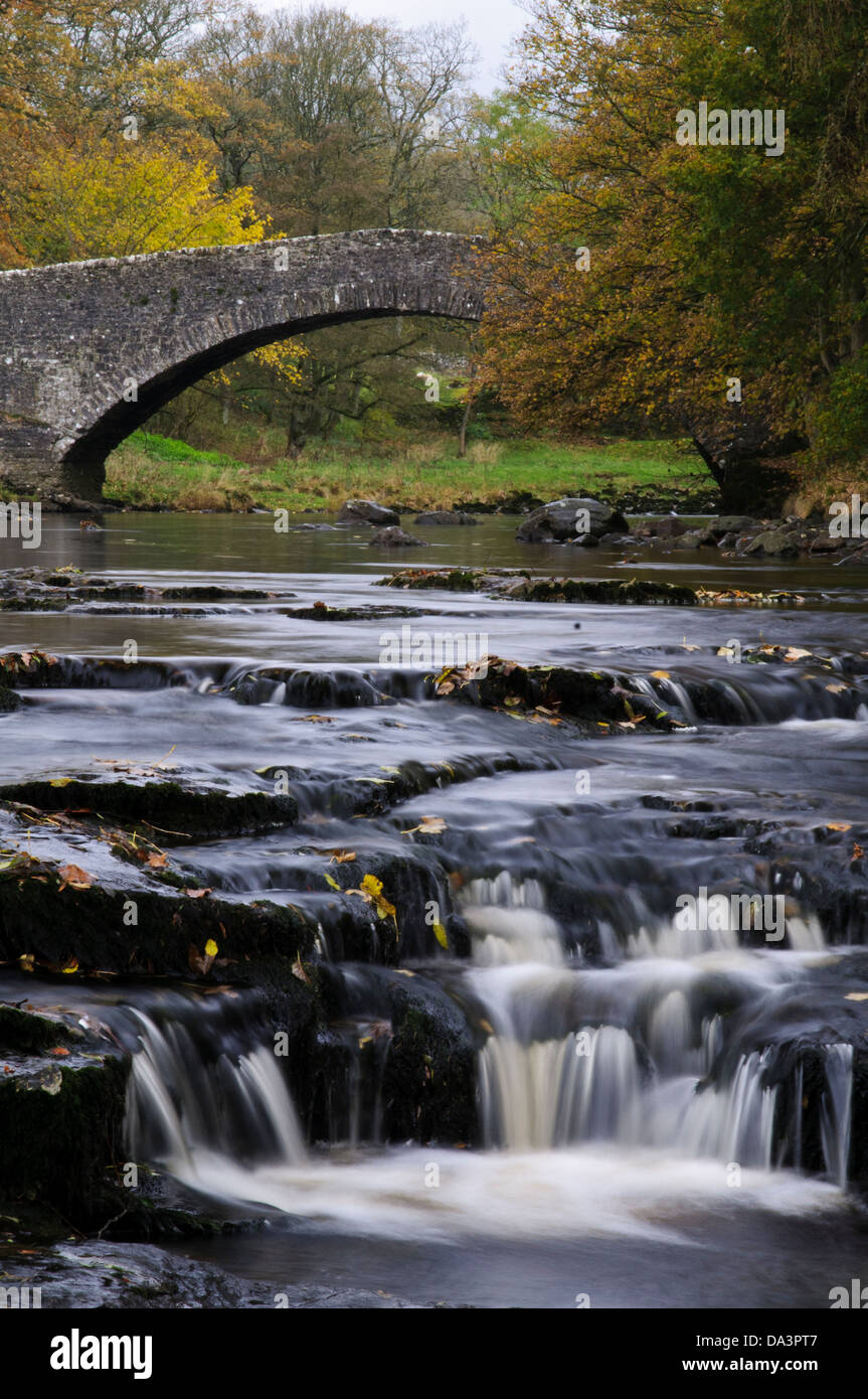 Stainforth Force on the River Ribble in autumn, with the old pack-horse ...