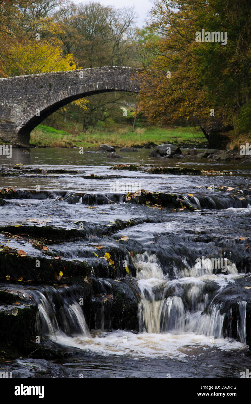 Stainforth Force on the River Ribble in autumn, with the old pack-horse ...