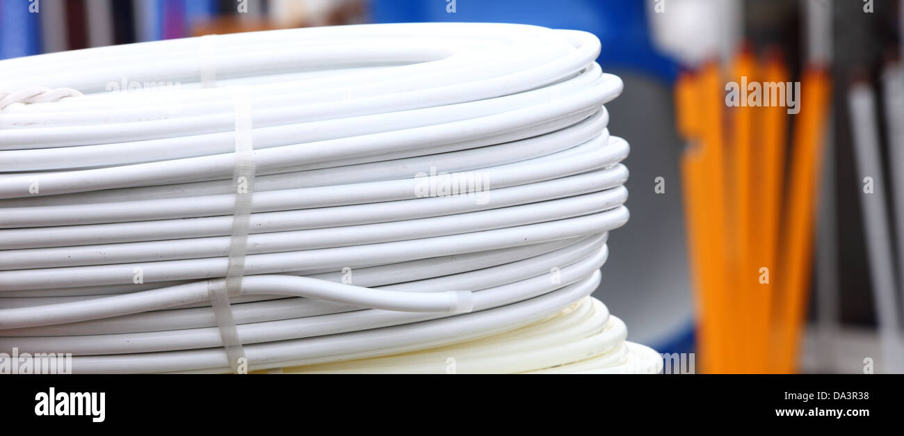 rolled up of white hose pipe industrial detail Stock Photo - Alamy