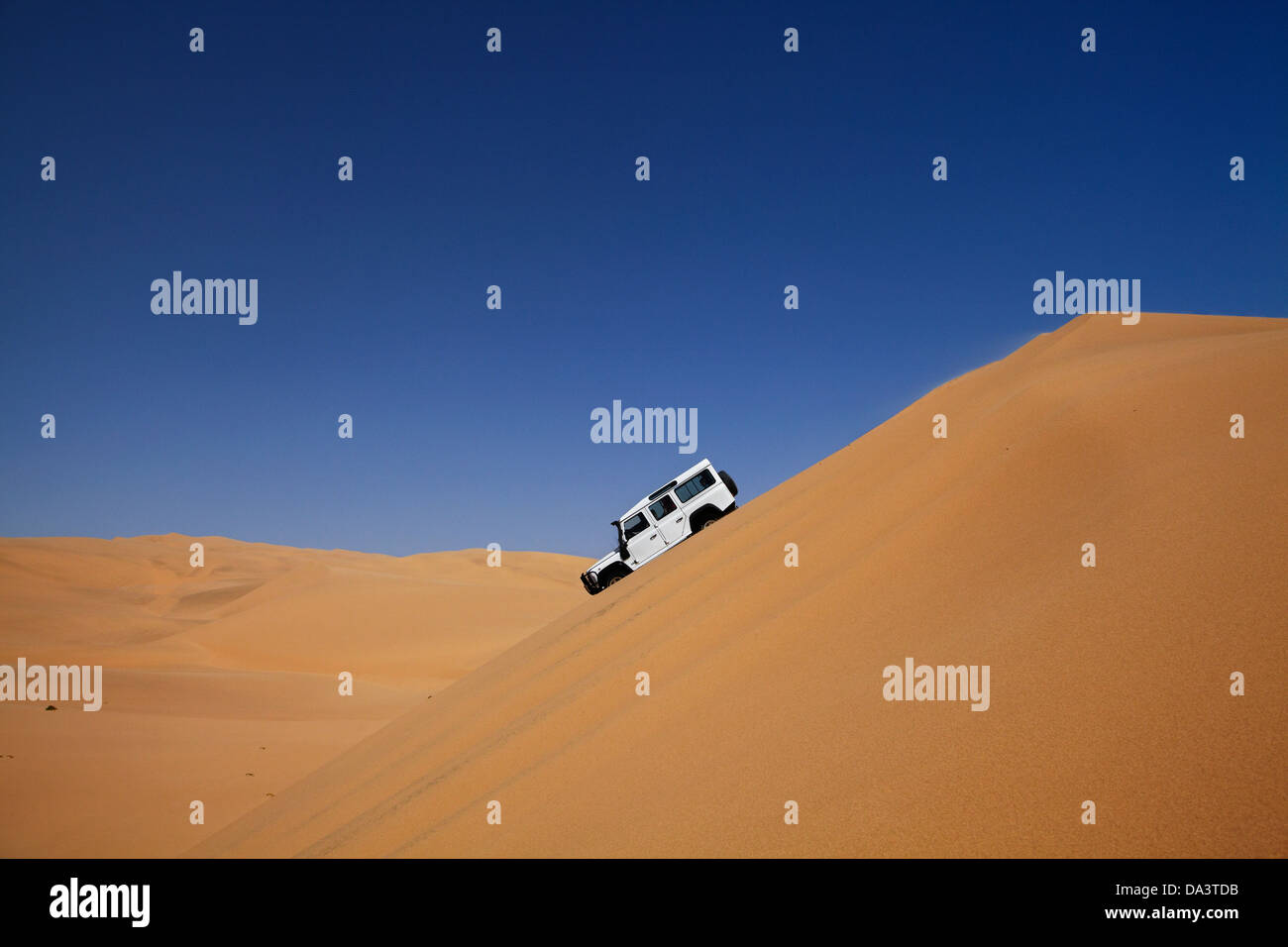 Four wheel drive descending a huge sand dune on a Sandwich Harbour 4x4 ...