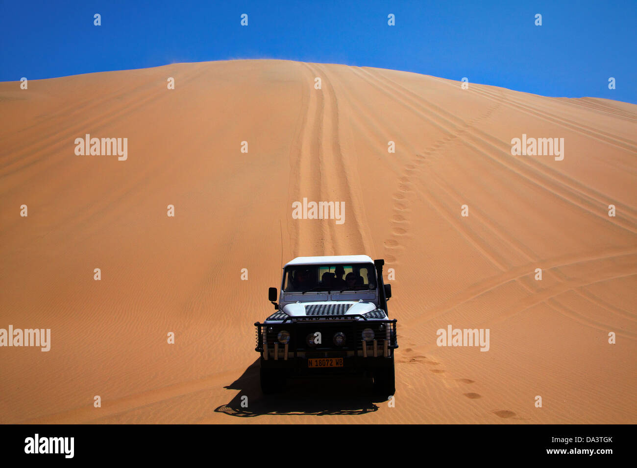 Four wheel drive descending a huge sand dune on a Sandwich Harbour 4x4 ...
