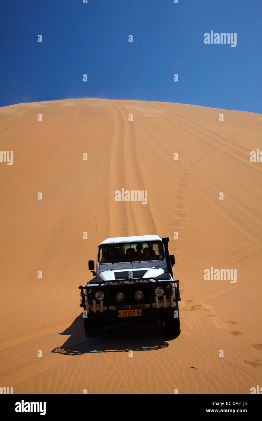 Four wheel drive descending a huge sand dune on a Sandwich Harbour 4x4 ...