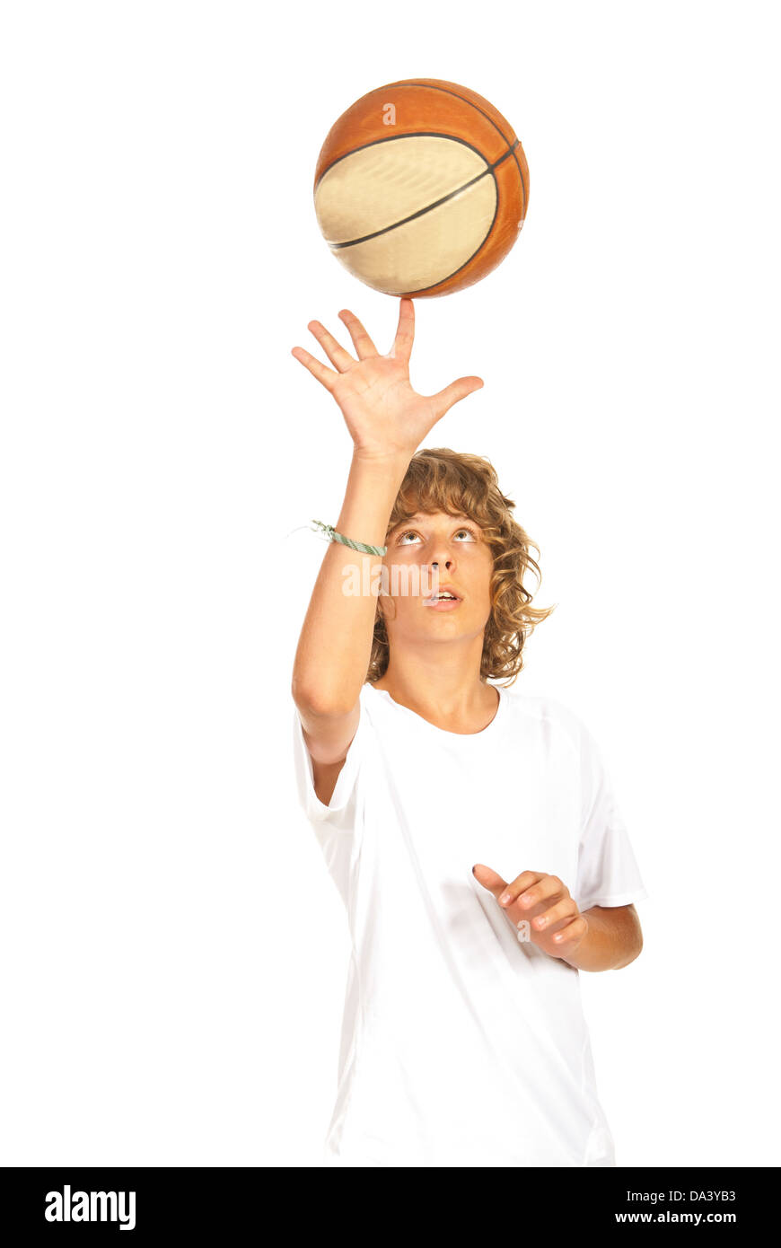Basketball teen boy player spinning ball on his finger isolated on ...