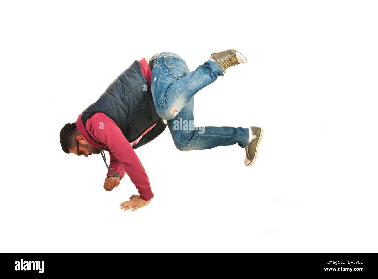 Freestyle dancer man with legs in the air isolated on white background ...