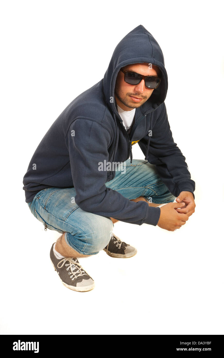 Hooded hip hop man posing isolated on white background Stock Photo - Alamy
