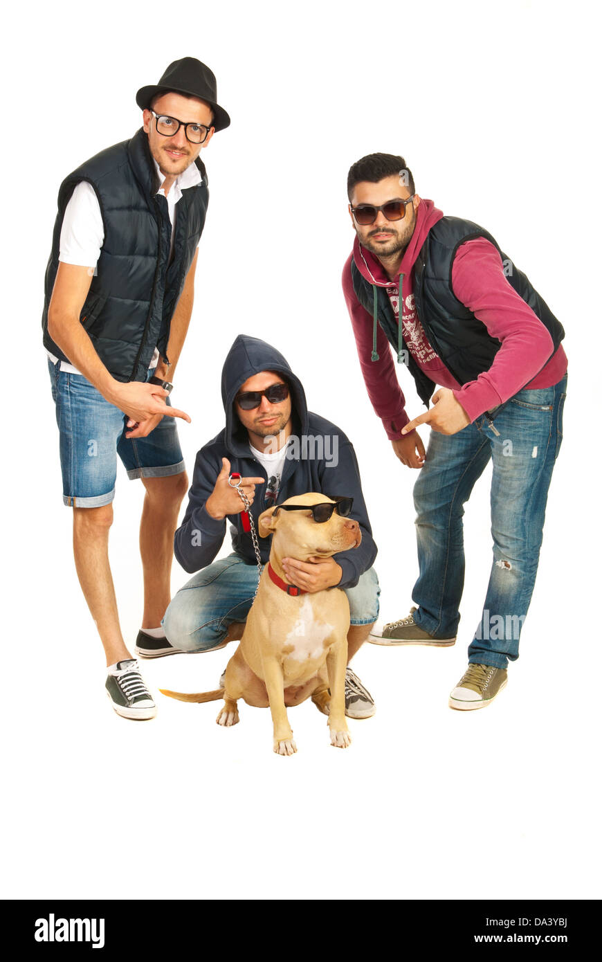 Funky group of three rappers pointing to their pitbull dog with ...