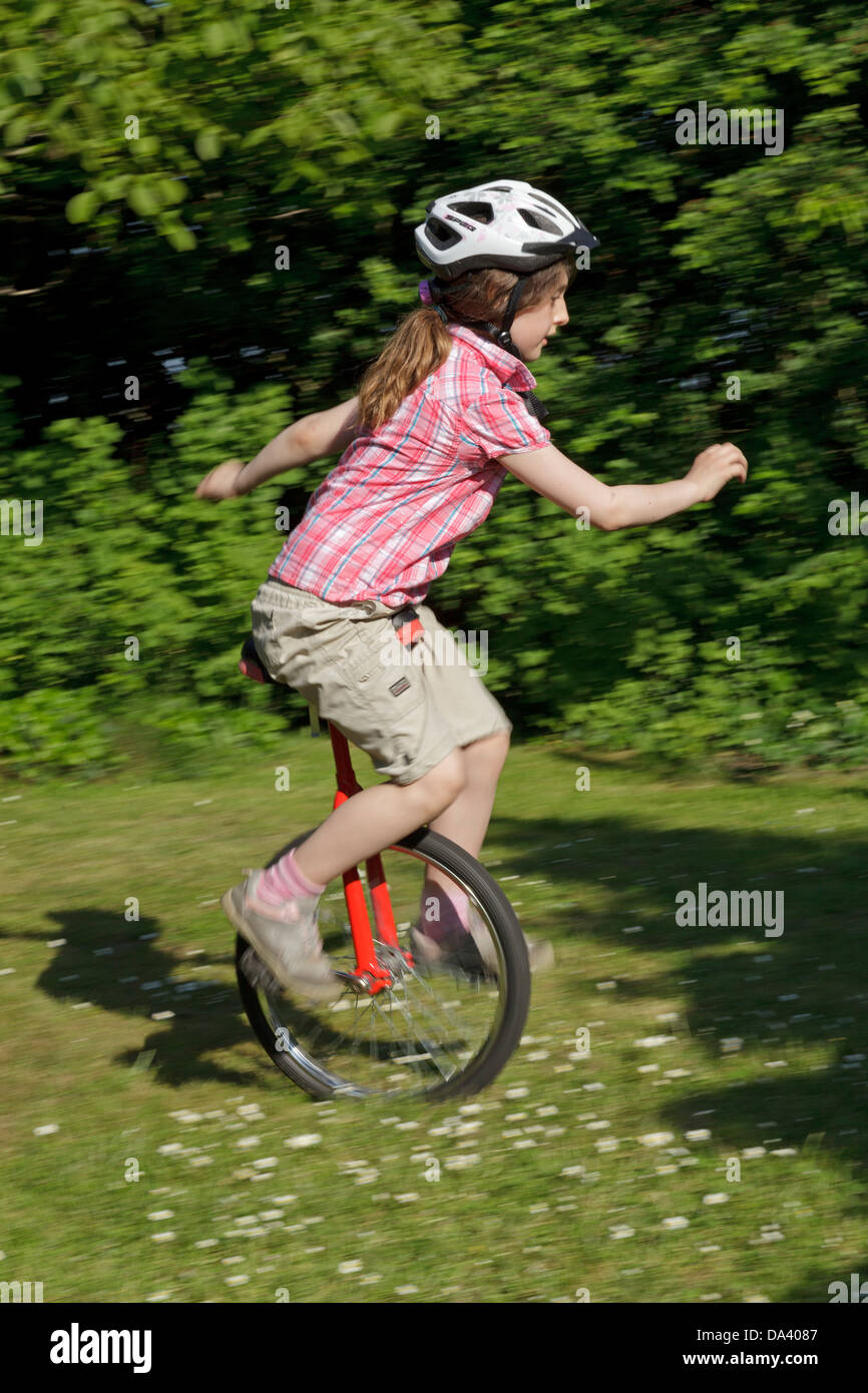 young girl on a unicycle Stock Photo - Alamy