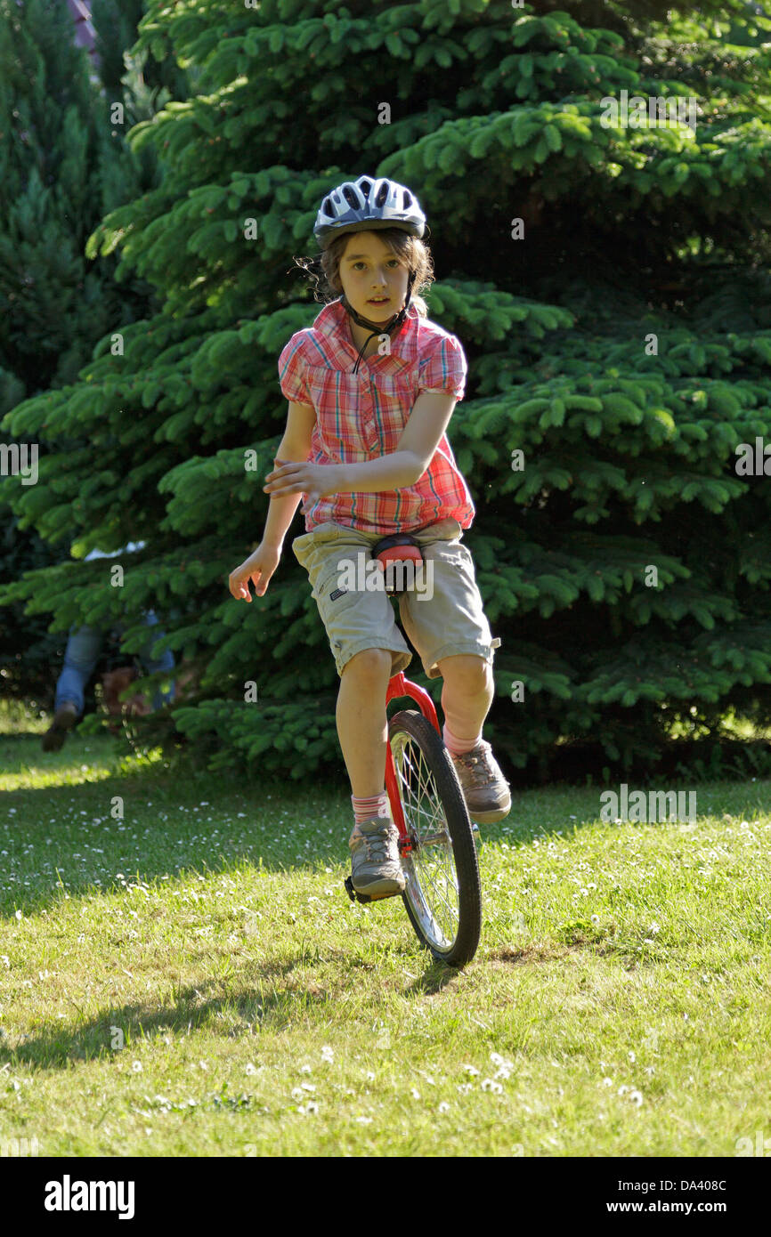 Child unicycle hi-res stock photography and images - Alamy