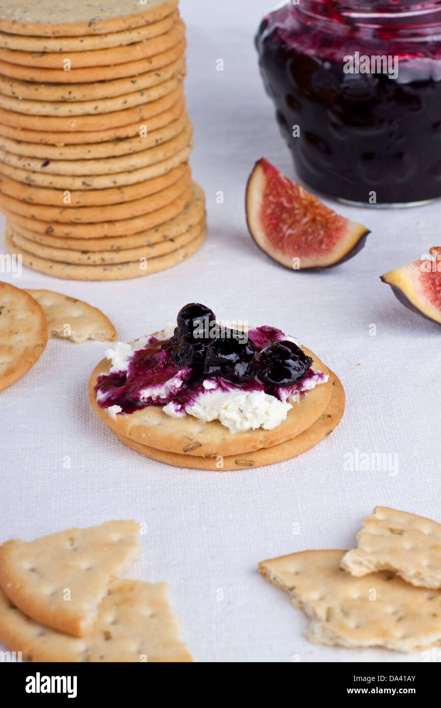 Appetizer cracker with cream cheese and jam Stock Photo - Alamy