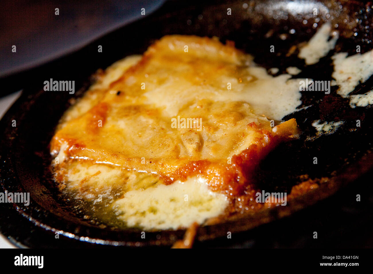 Flaming greek cheese hi-res stock photography and images - Alamy