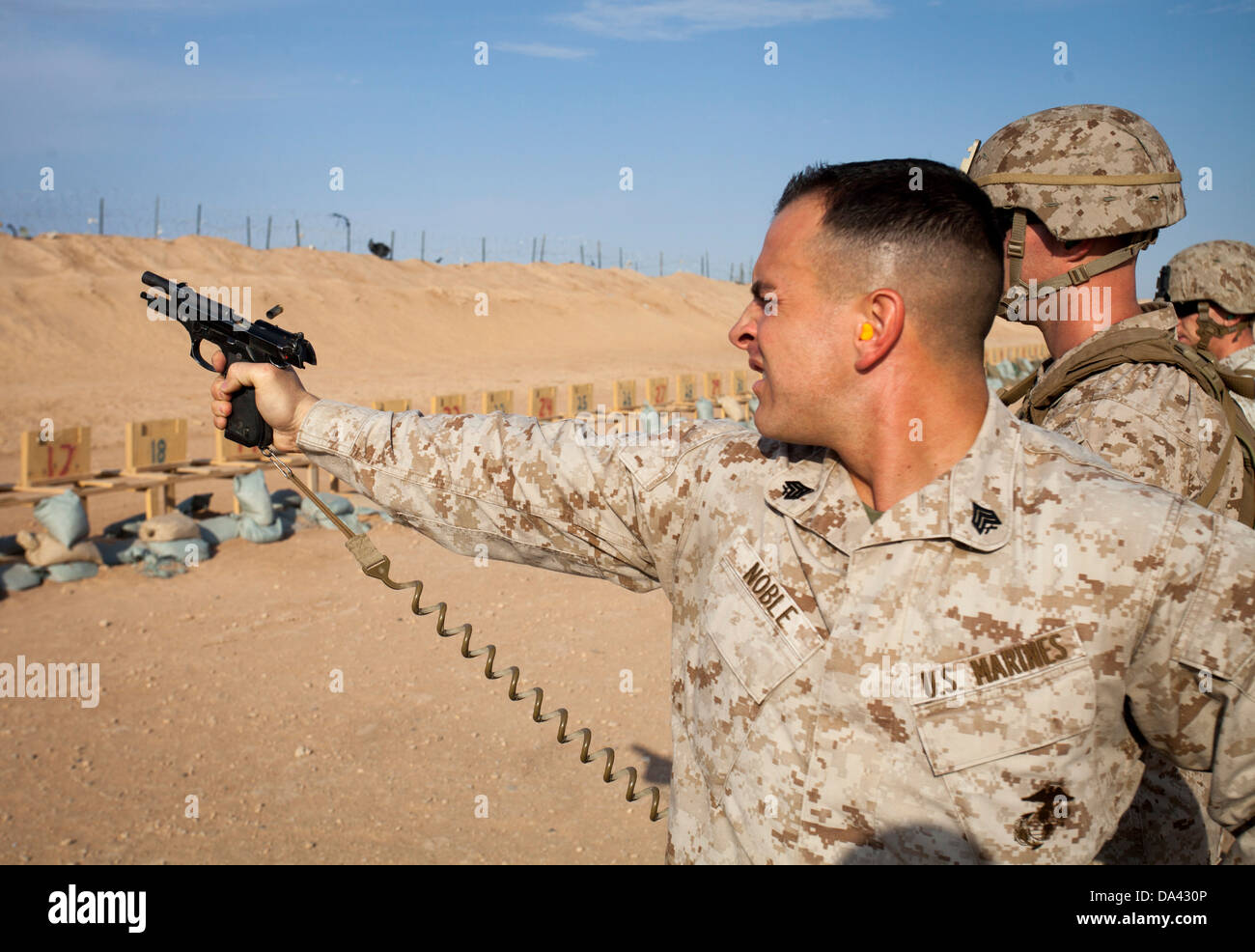U.S. Marine Corps Sgt. Phillip Noble, left, with Regimental Combat Team ...