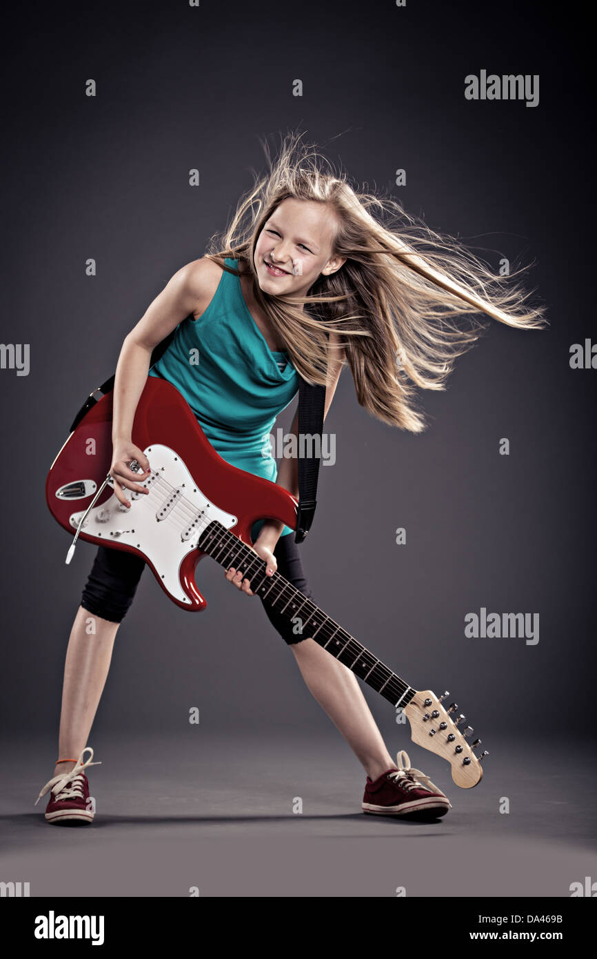 portrait of young girl with a guitar on the stage Stock Photo - Alamy