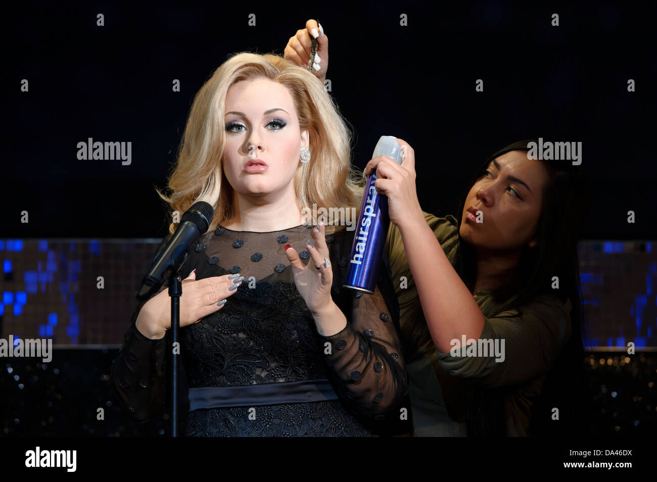 Final adjustments are made to the waxwork of British singer, Adele at ...