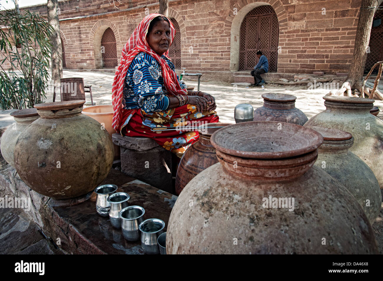 Woman selling water in Mehrangarh fort. Jodhpur, Rajasthan, India Stock ...