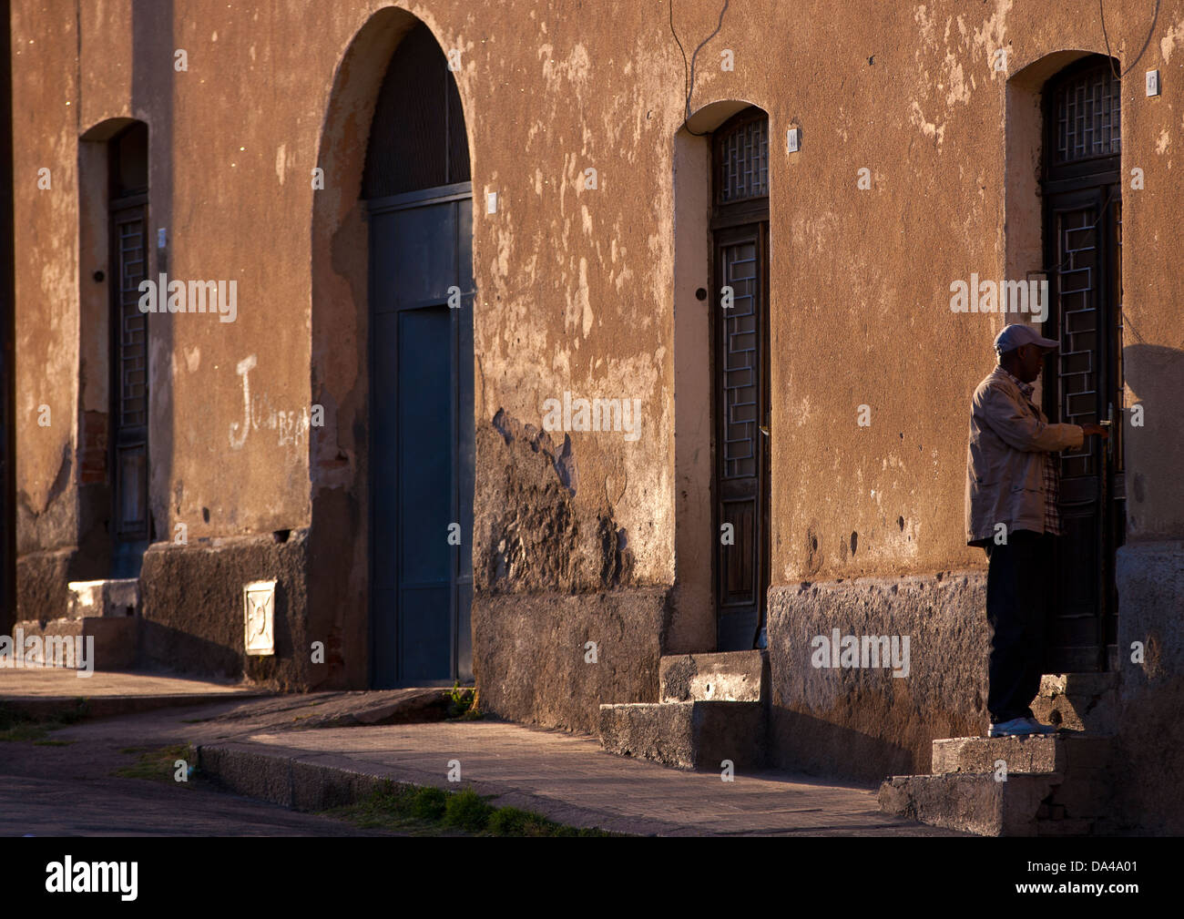 Man Entering His Home, Asmara, Eritrea Stock Photo - Alamy