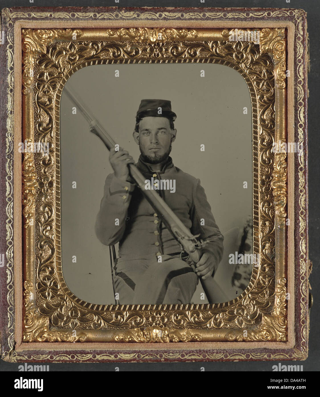 [Unidentified soldier in Confederate uniform with flintlock musket ...
